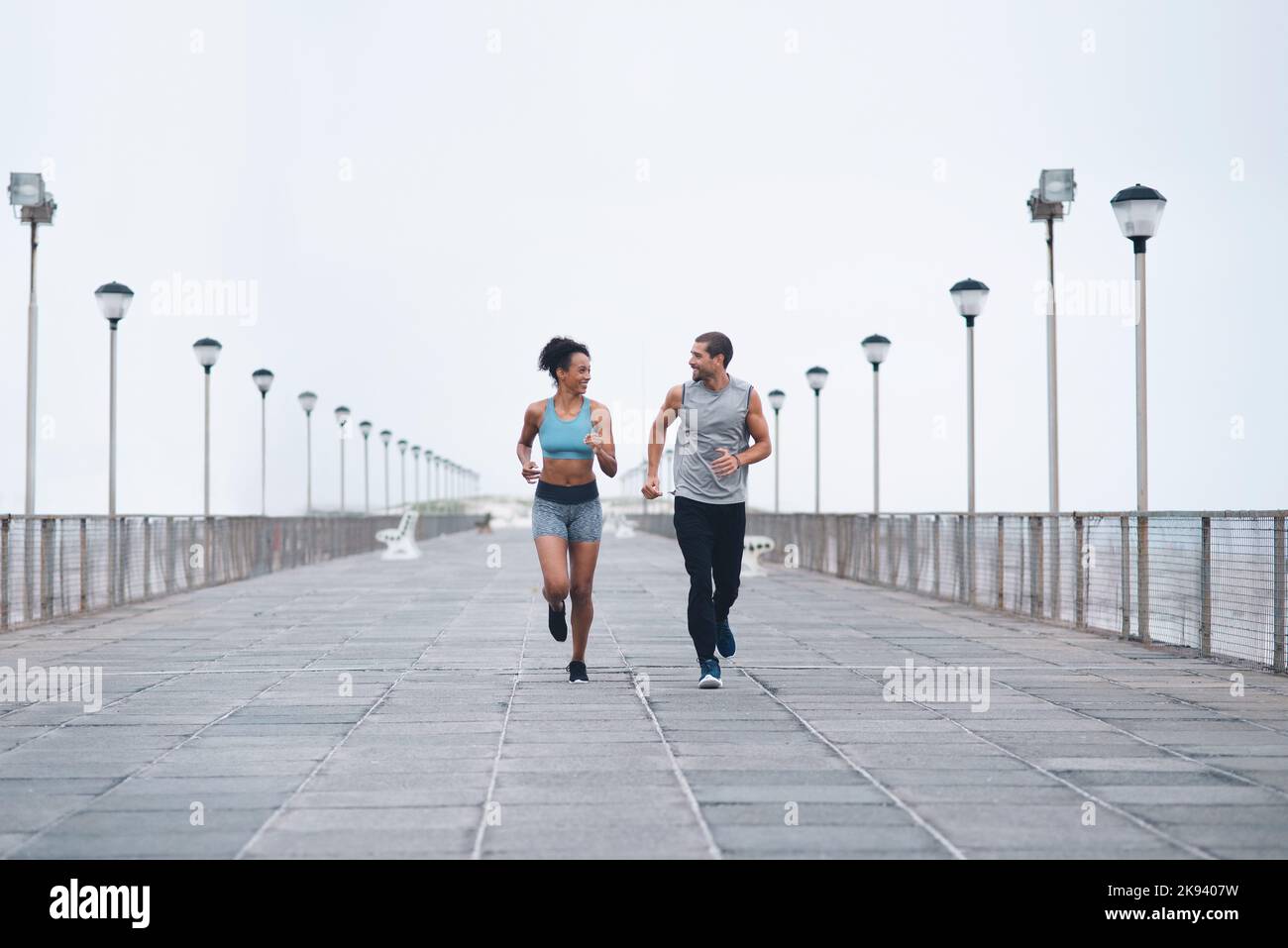 Exercising together young multiracial couple hi-res stock photography ...