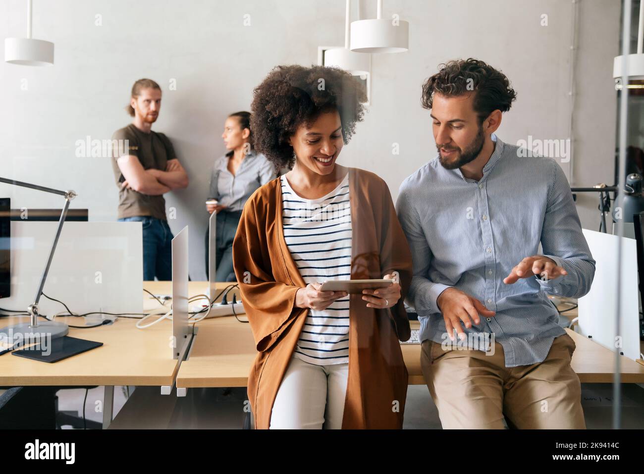 Team of young creative marketing experts brainstorming during work ...