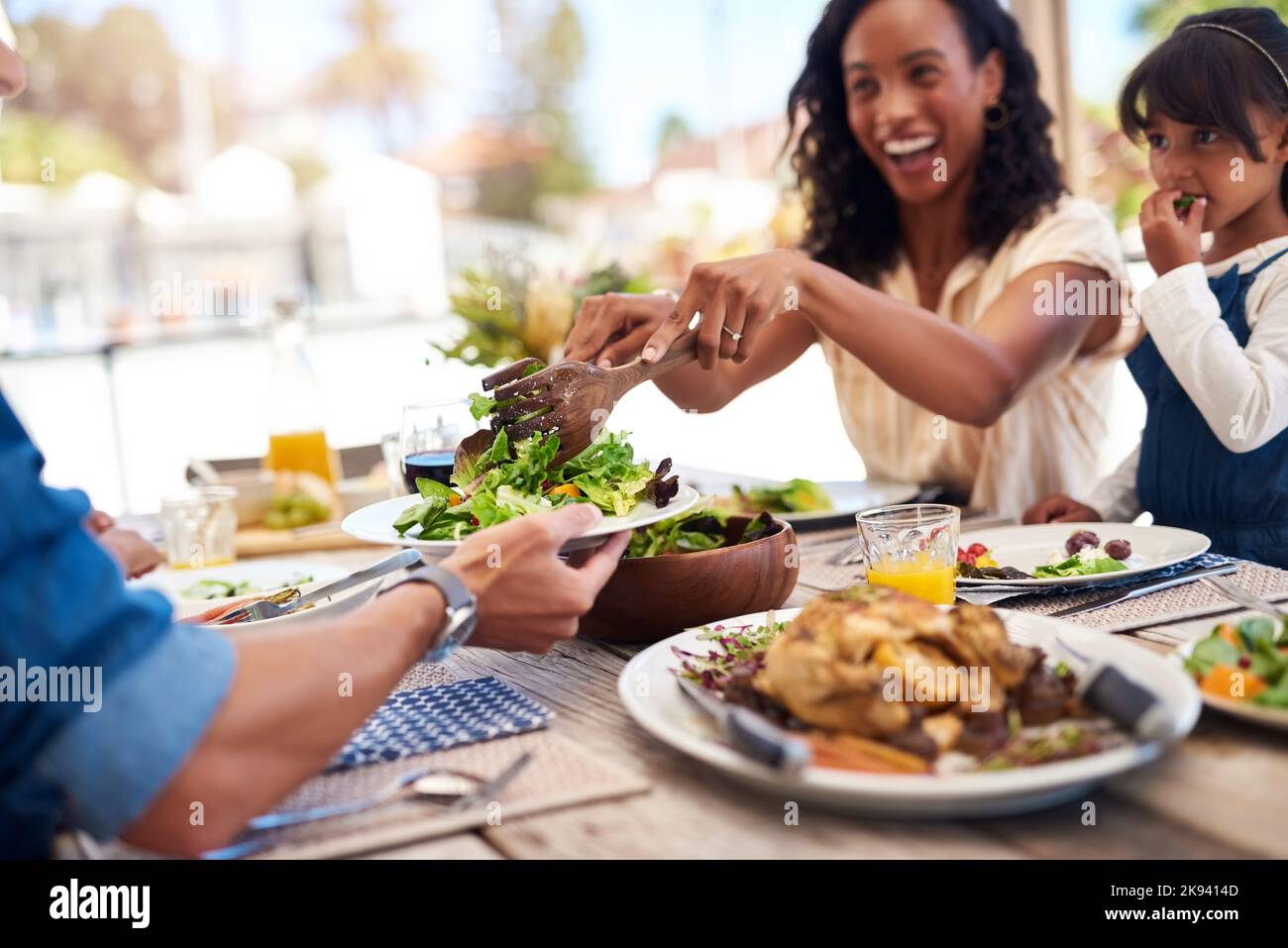 Were living a healthy and happy life. a beautiful young woman dishing ...