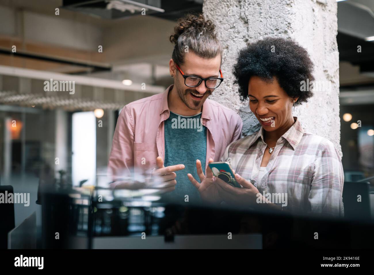 Successful business people, designer enjoying work together. Business ...