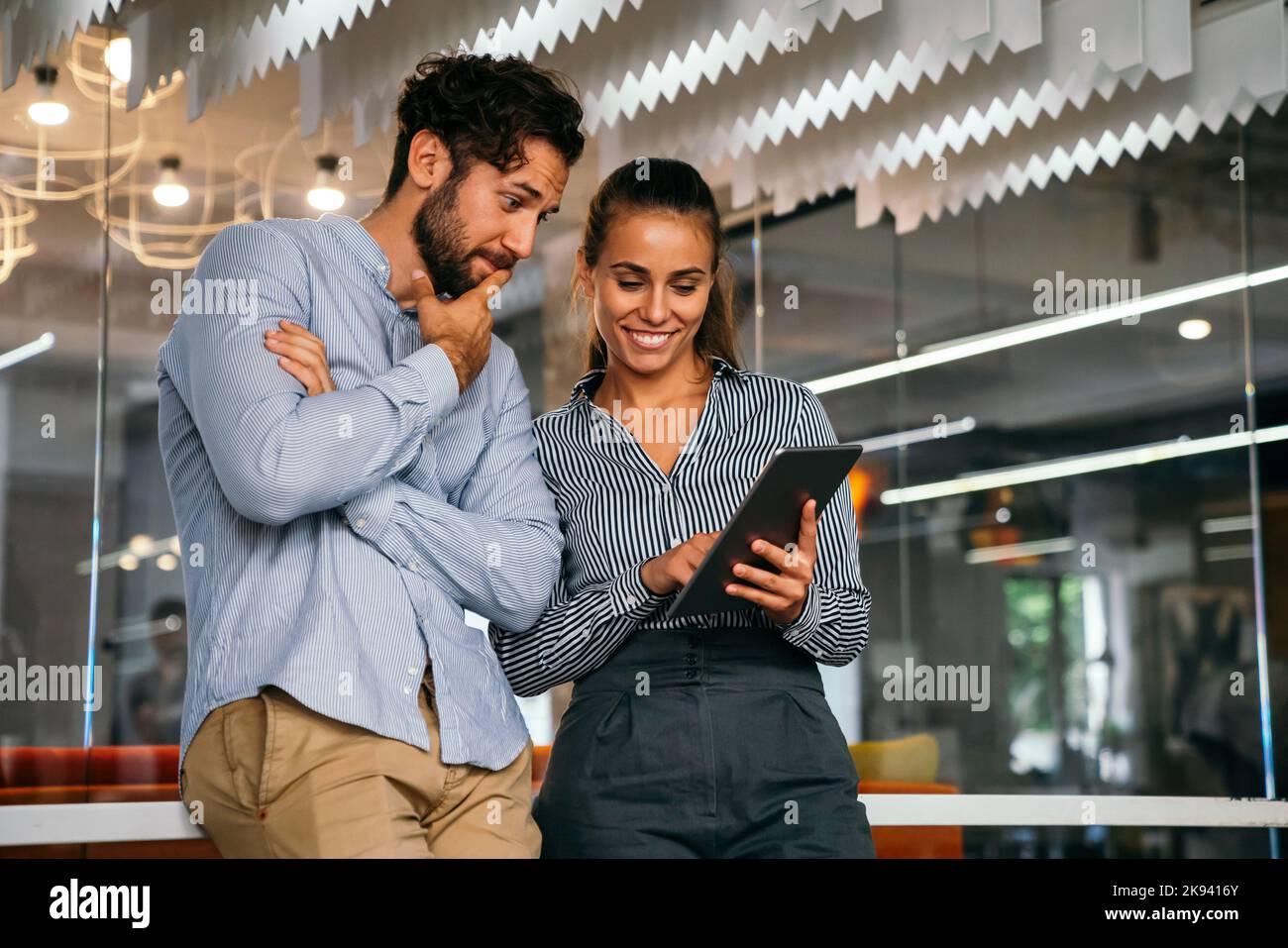 Team of young creative marketing experts brainstorming during work ...