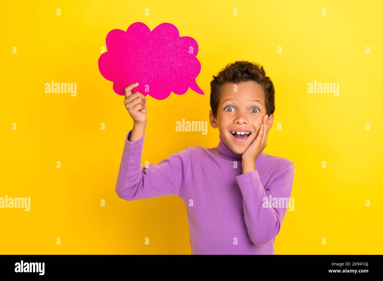 Portrait of astonished little person arm touch cheek hold empty space ...