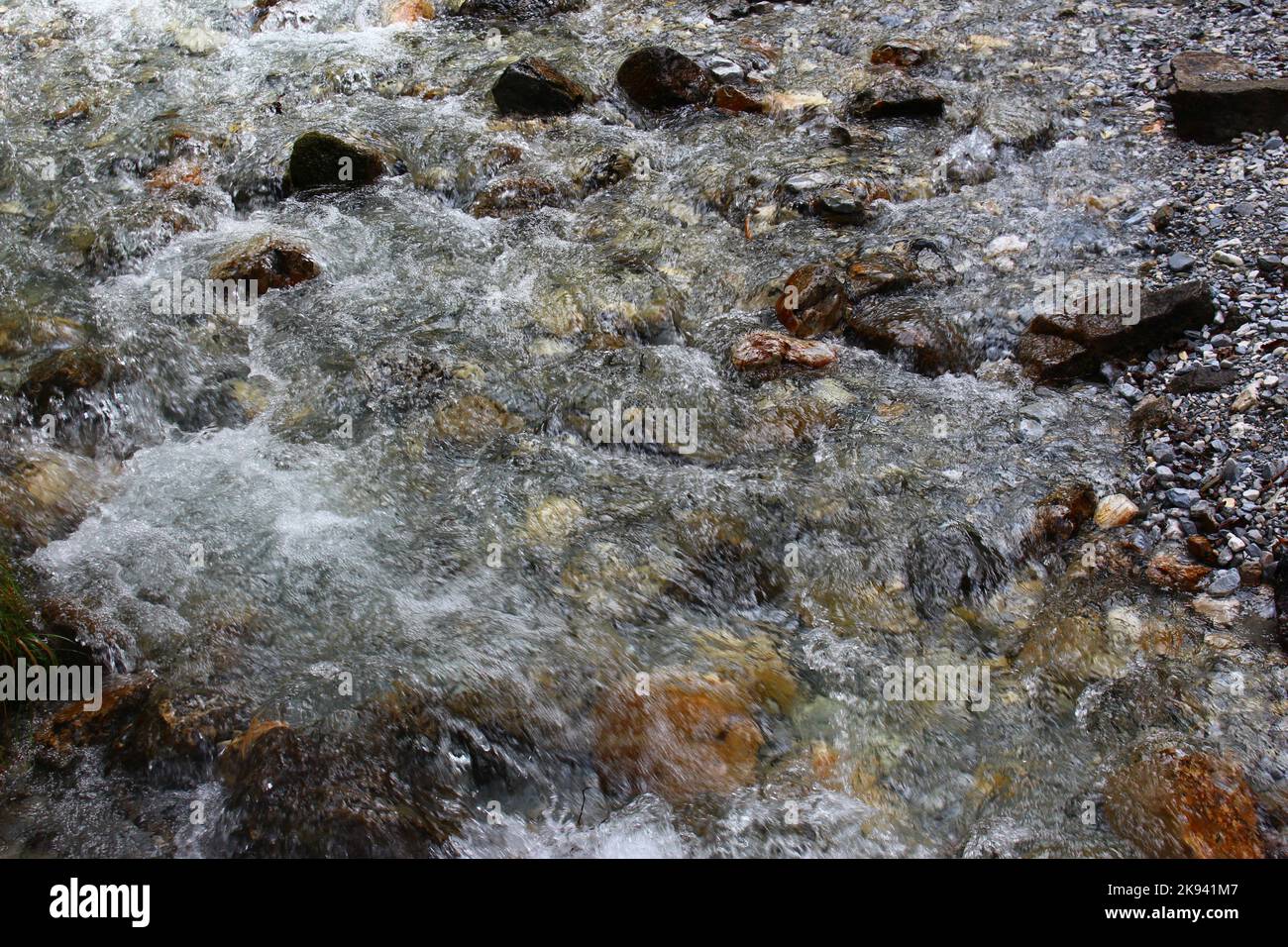 water sparkling around stones Stock Photo - Alamy