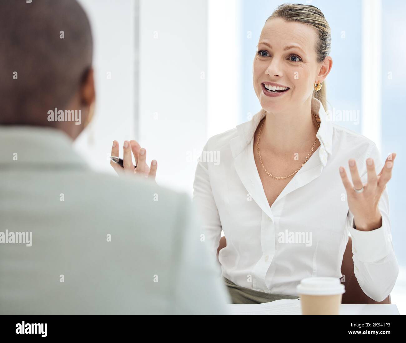 Smiling professional employees talking work hi-res stock photography ...