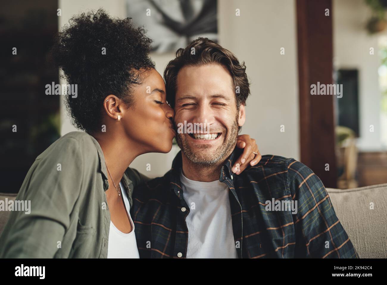 Spoiling him with all my love today. a young woman kissing her ...