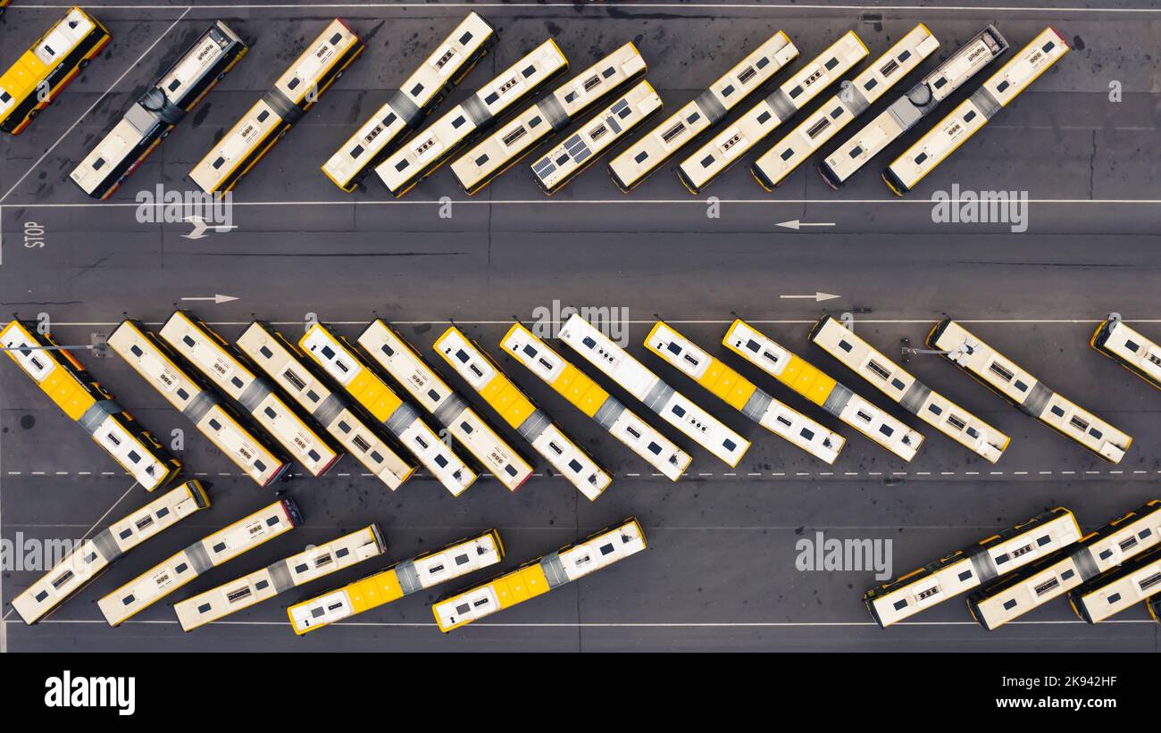 Numerous coaches and busses at bus terminus parked one next to each ...