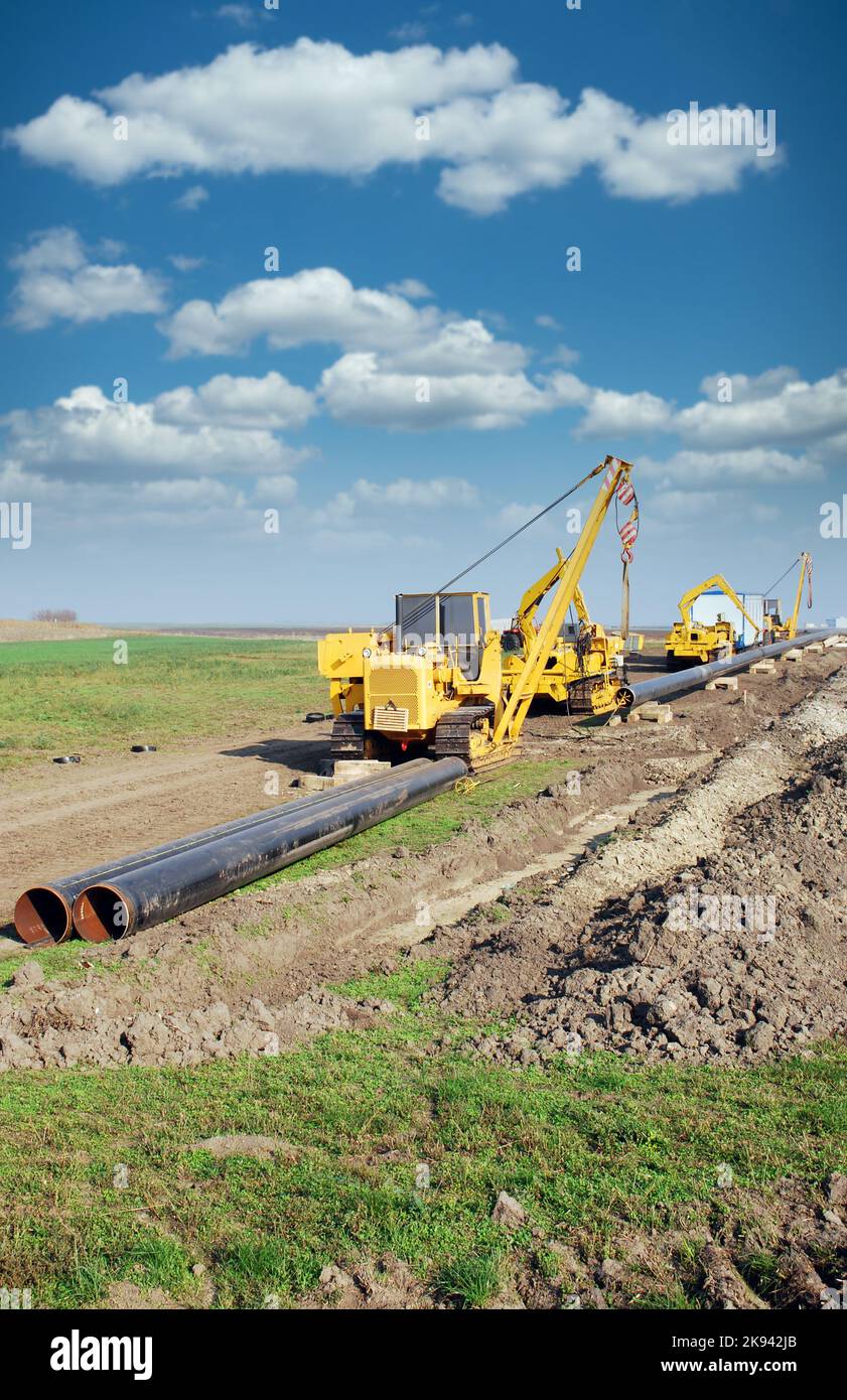gas pipeline and machinery construction site Stock Photo - Alamy
