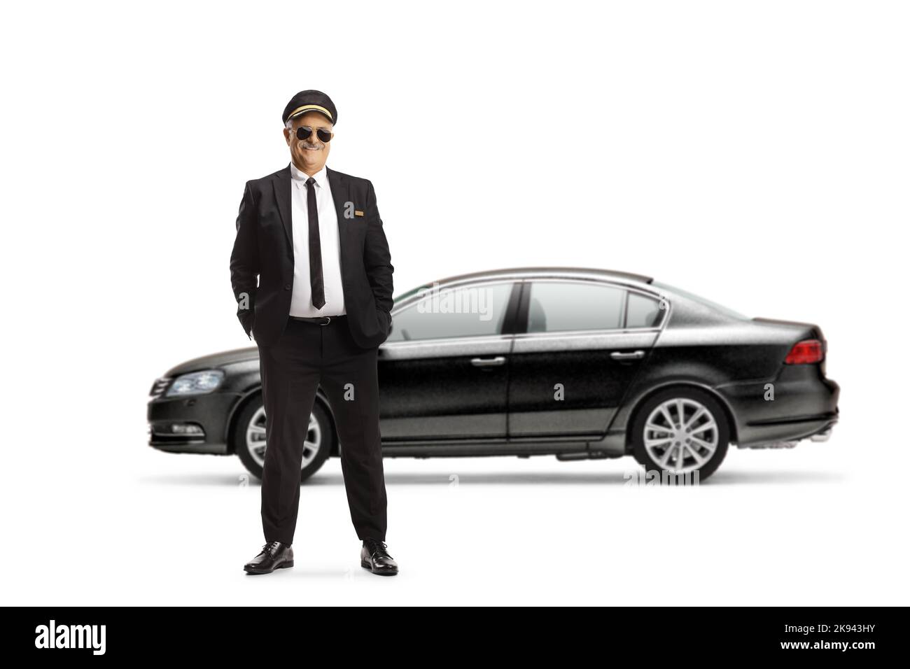 Full length portrait of a mature chauffeur posing in front of a black ...
