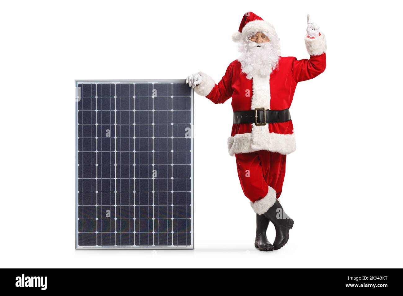 Santa claus leaning on a big solar panel and pointing up isolated on ...