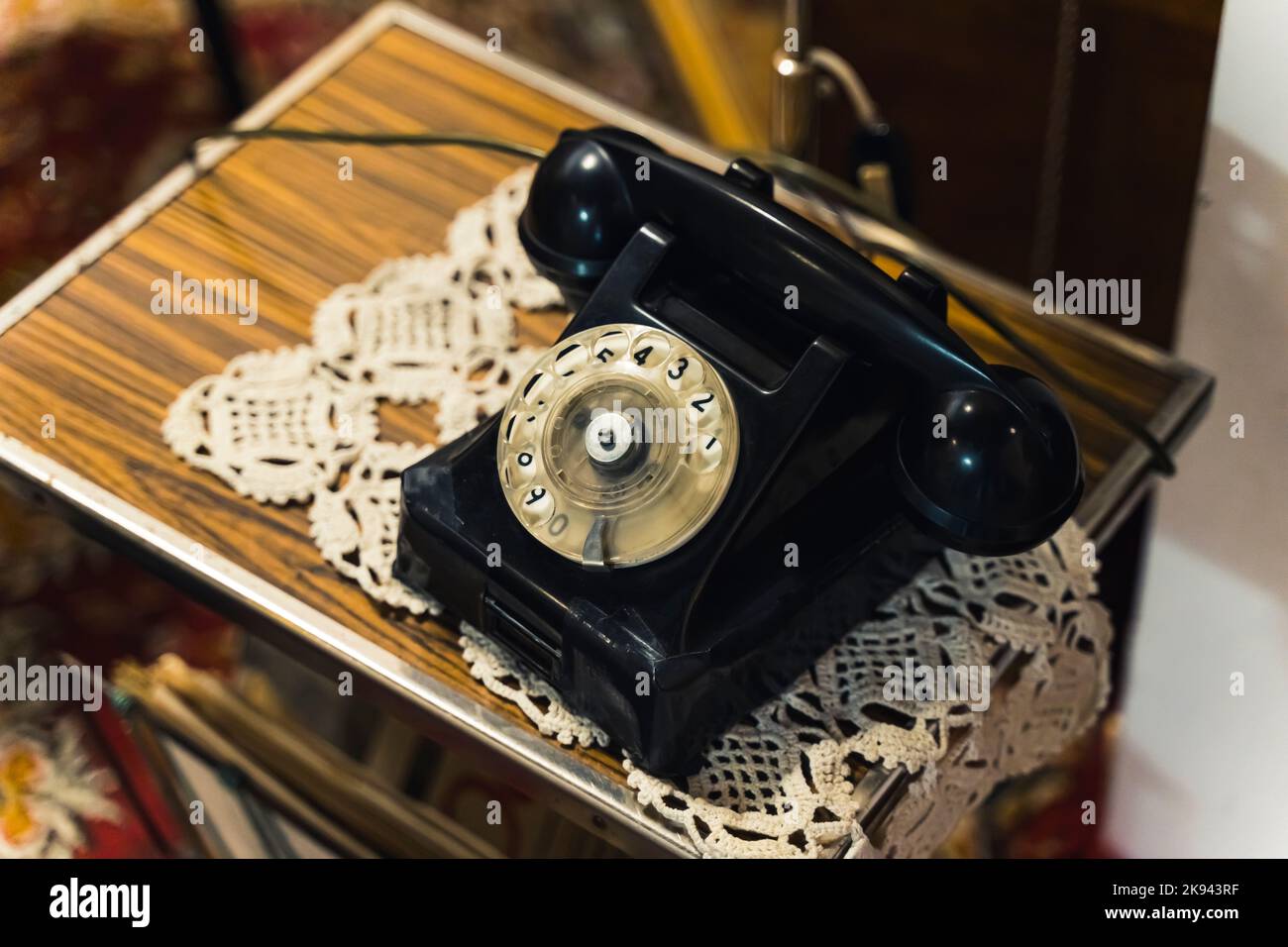 Elegant vintage authentic shiny black telephone set with round phone ...