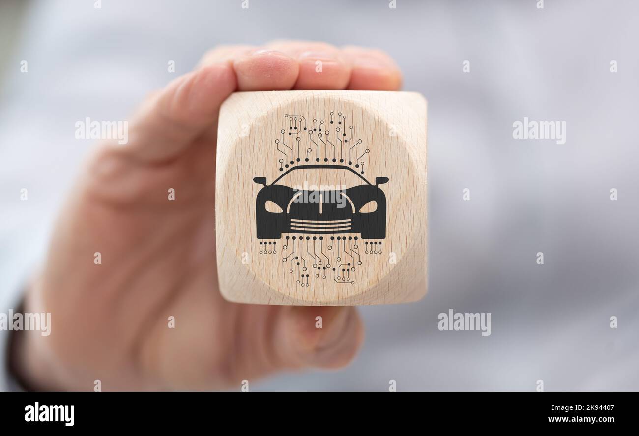 Hand holding a wooden cube with symbol of smart car concept Stock Photo ...