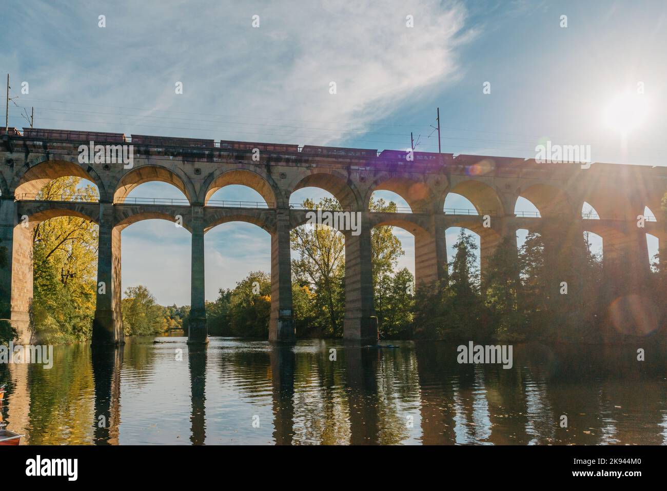 Germany train passing train bridge on cloudy day in germany hi-res ...