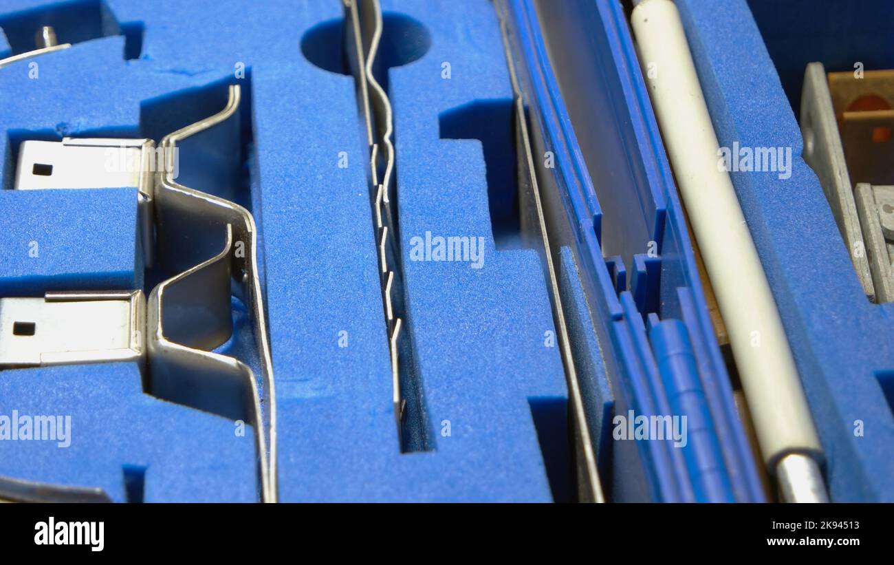 Close-up various metallic machine details in the blue foam rubber ...