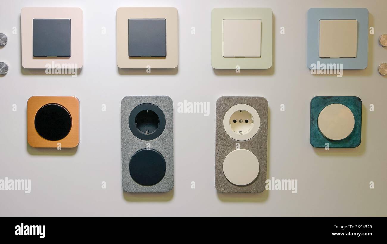 White wall with various sockets and switches. European house electricic ...