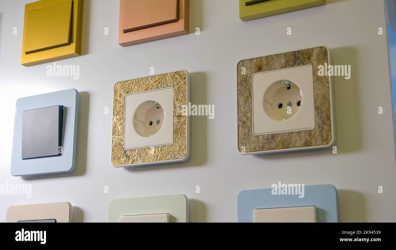 Various sockets and switches on the white wall. Electrical equipment ...