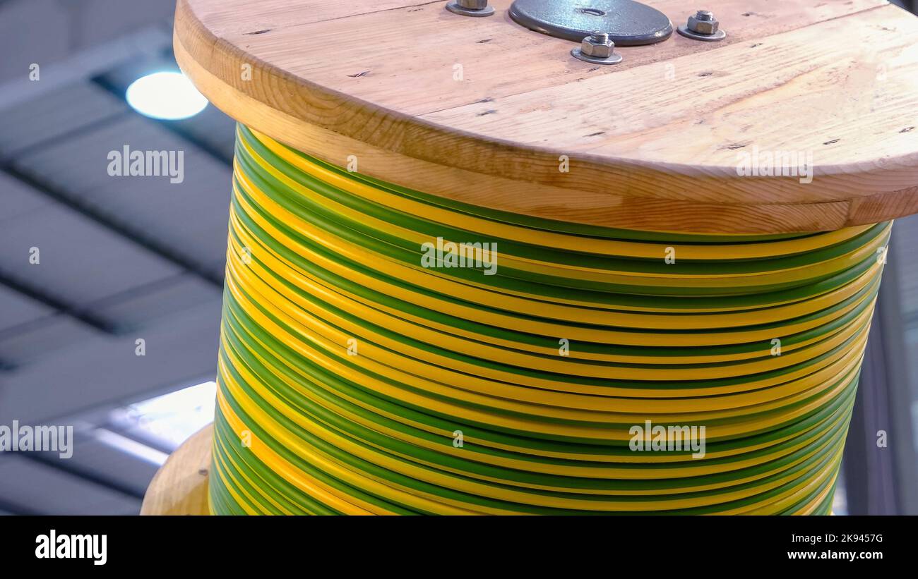 High and low voltage cables in the storage. Wooden coil of electric ...