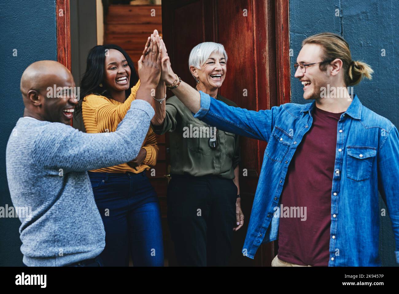 Weve all got that winners mentality. a group of businesspeople joining ...