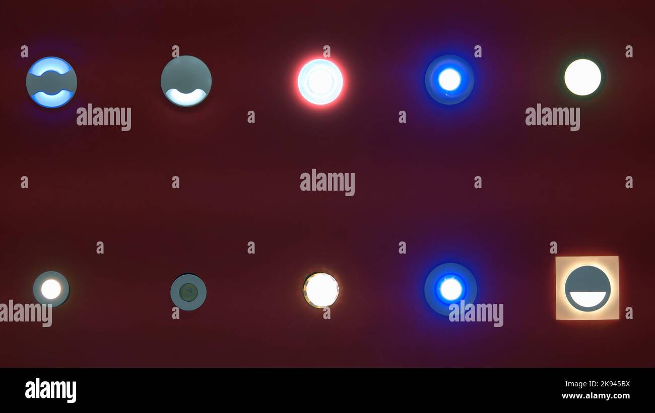 Various LED built-in lamps on a red ceiling. Chrome finish and matt ...