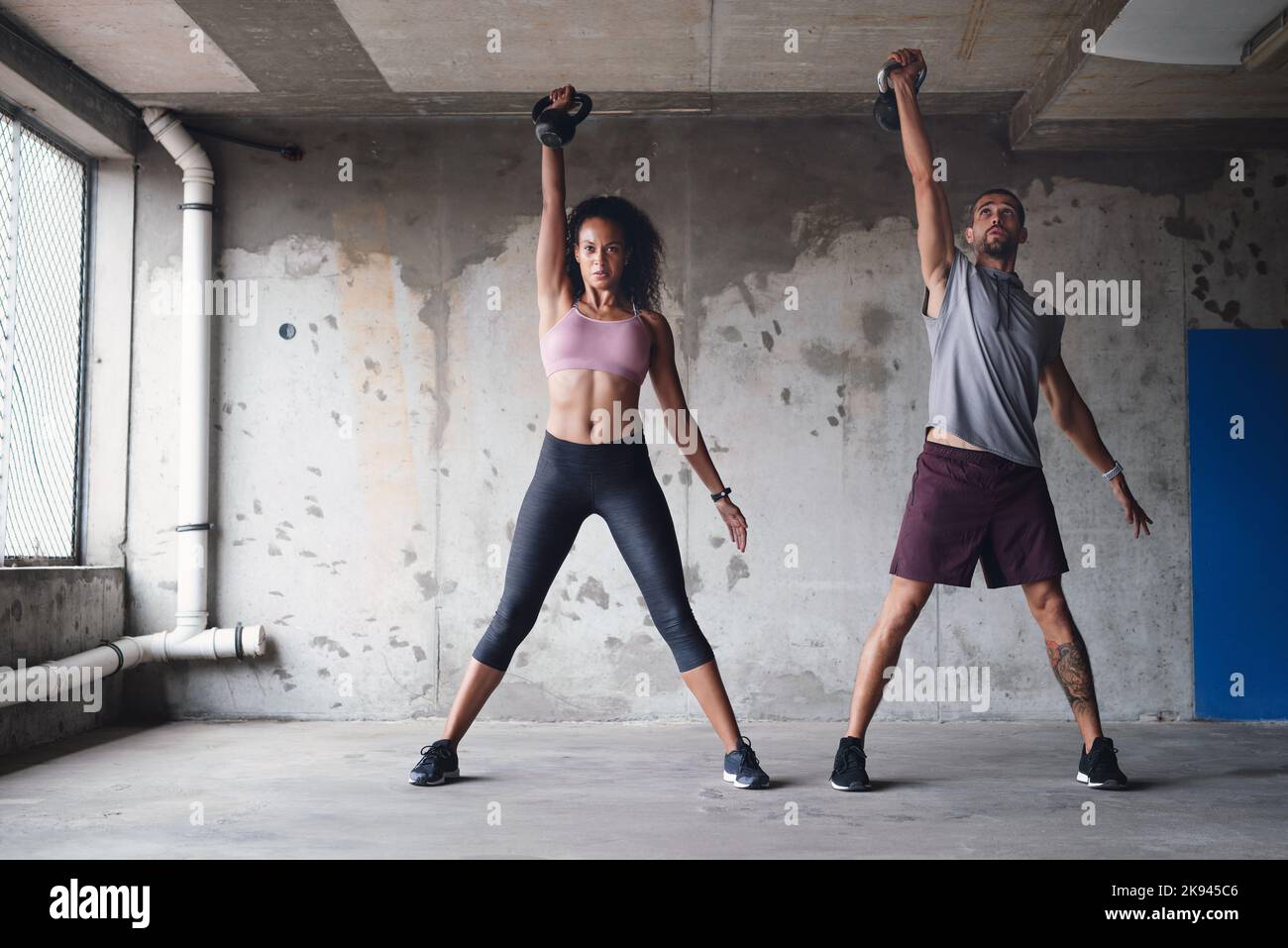 Were picking up from where we left off. Full length shot of a sporty young couple exercising ...