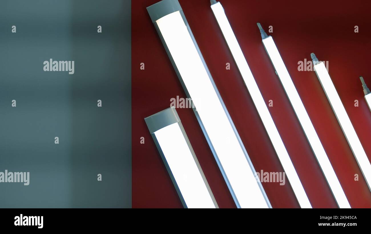 Various glowing horizontal lamps on the red ceiling. Room light ...