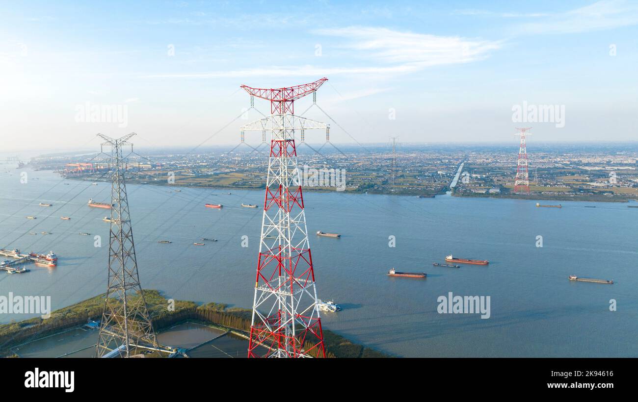WUXI, CHINA - OCTOBER 25, 2022 - Cargo ships sail along the Yangtze River, flanked by the world ...