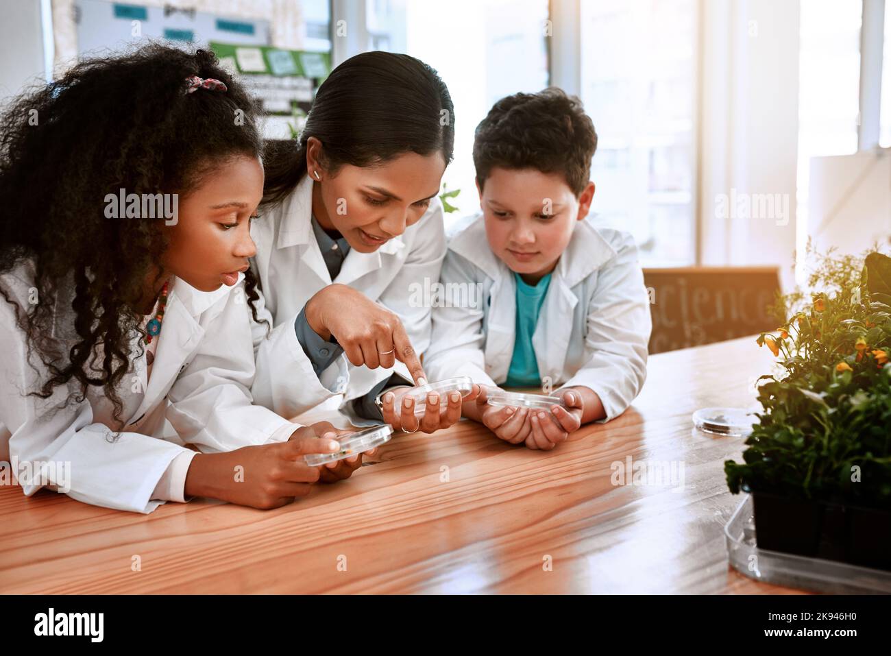 Explore more, learn more. an adorable little boy and girl learning ...
