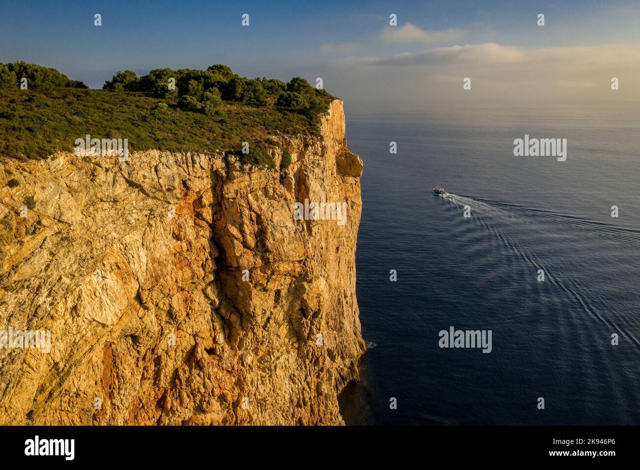 Aerial view of the Cap de la Barra cliff at sunrise. It is located in L ...
