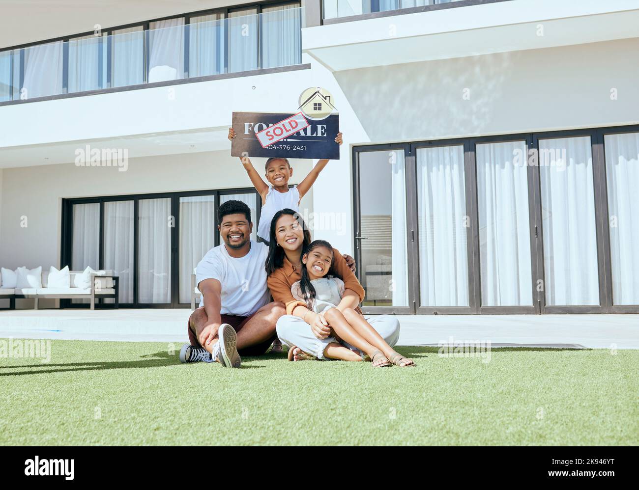 Property, happy family and sold sign with smile, relax and excited ...