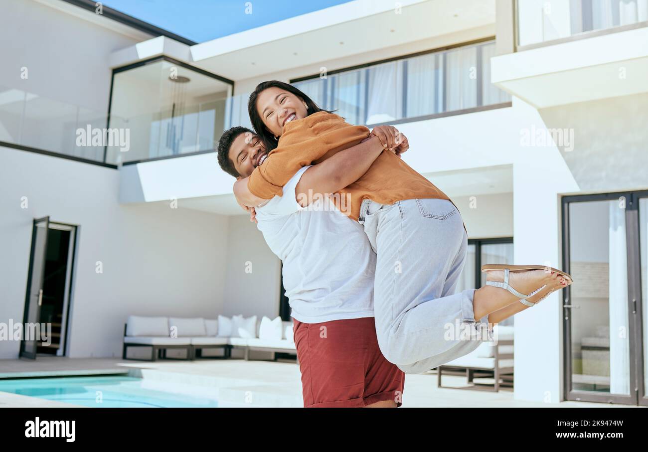 Hug, real estate and couple moving into their new home while excited ...