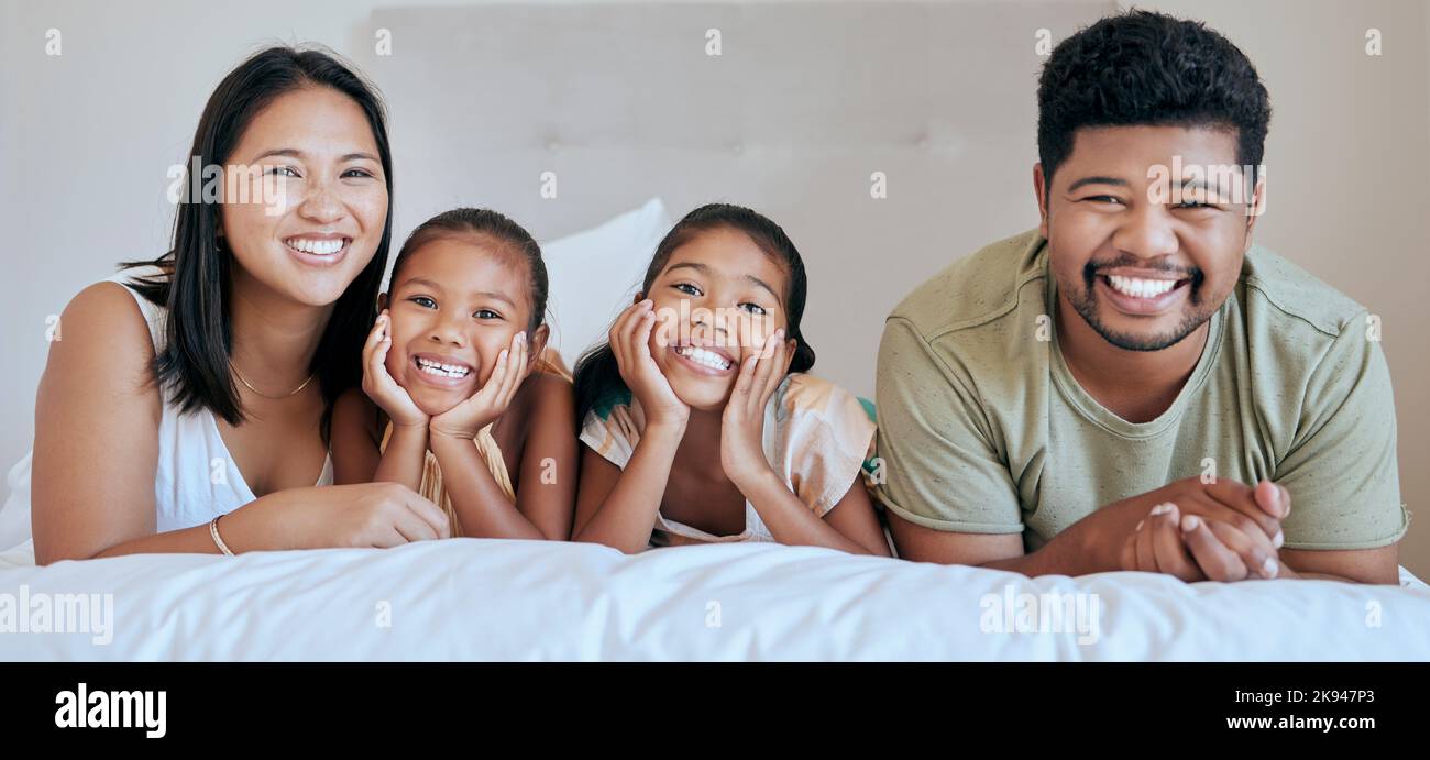 Happy, relax and family on a bed for peace, calm and smile together in ...