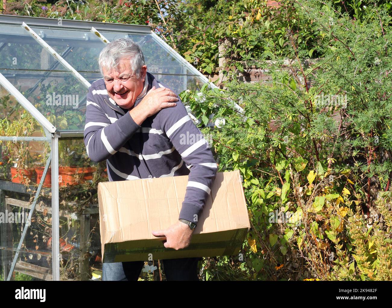 Lifting heavy weights incorrectly, not bending legs at the knee and ...