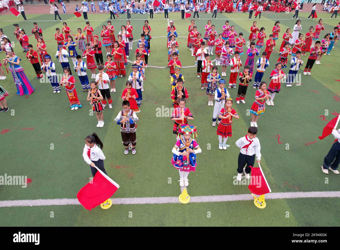 LIUZHOU, CHINA - OCTOBER 26, 2022 - Students play Hulusi, an ethnic ...
