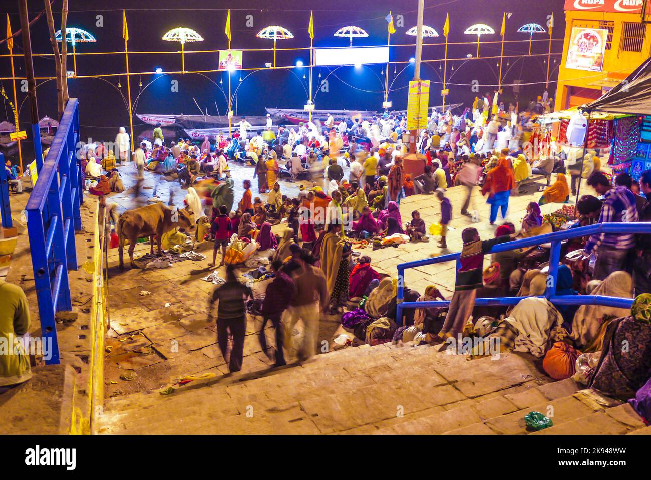 Varanasi, India - December 10, 2009: Hindu people wash themselves in ...