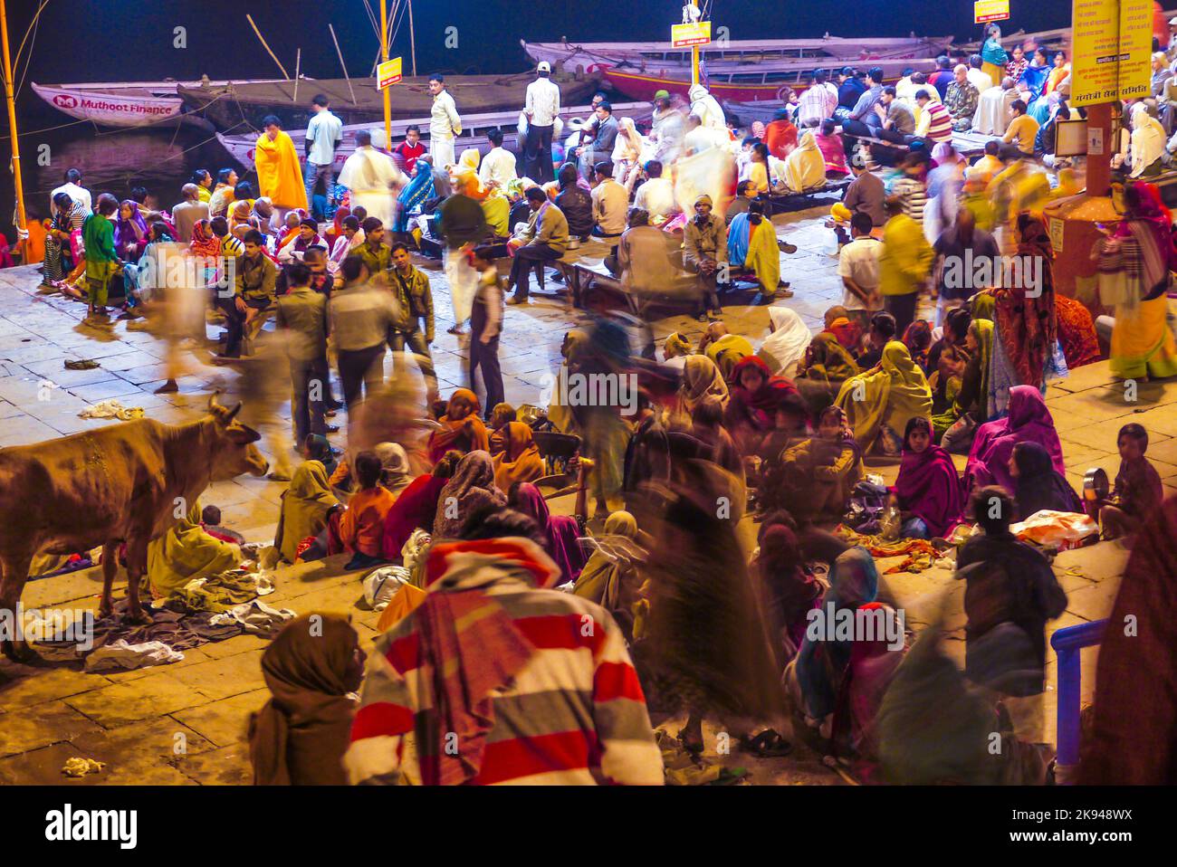 Varanasi, India - December 10, 2009: Hindu people wash themselves in ...