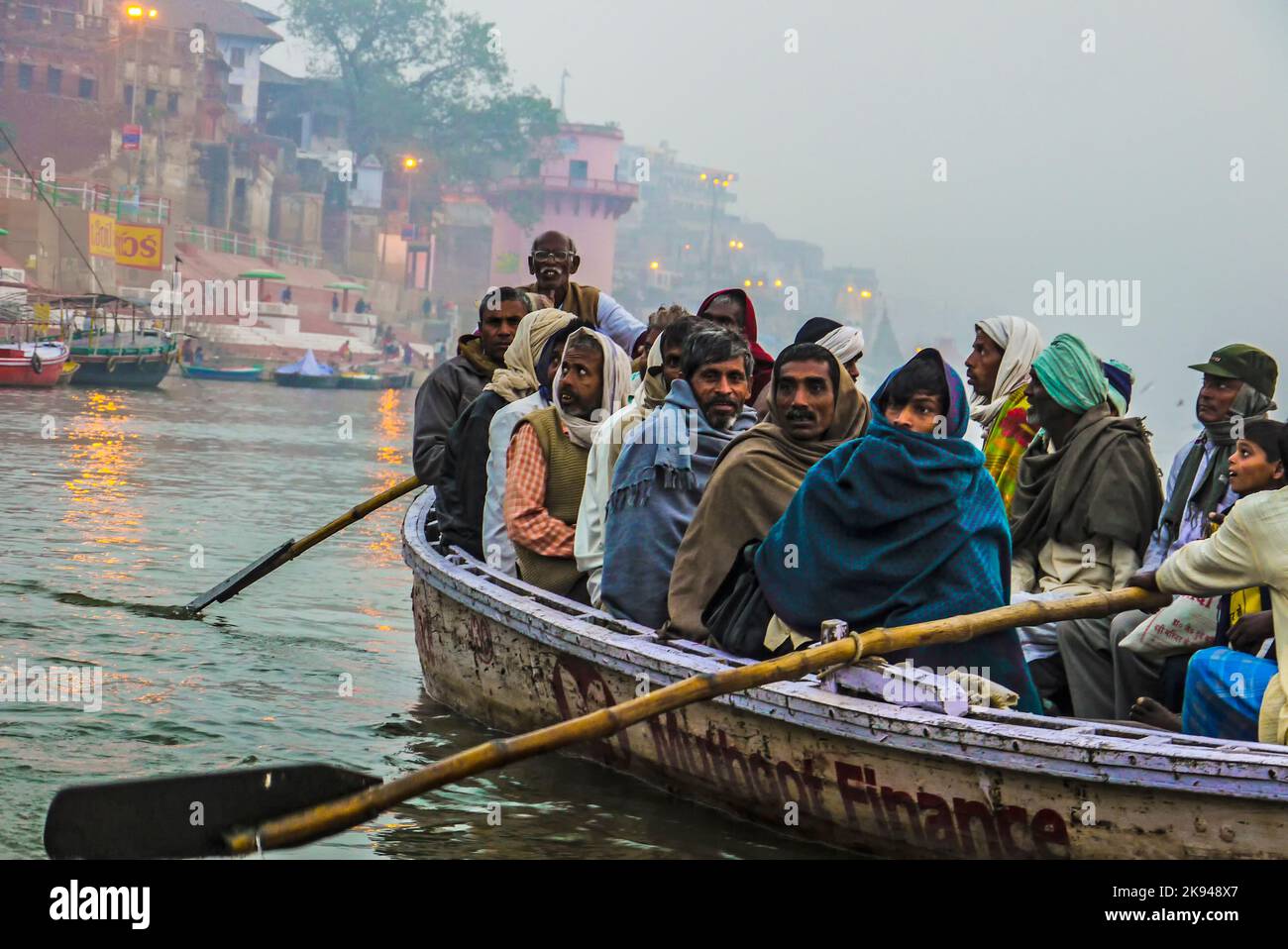 Varanasi, India - December 11, 2009: Hindu people in a boat on river ...