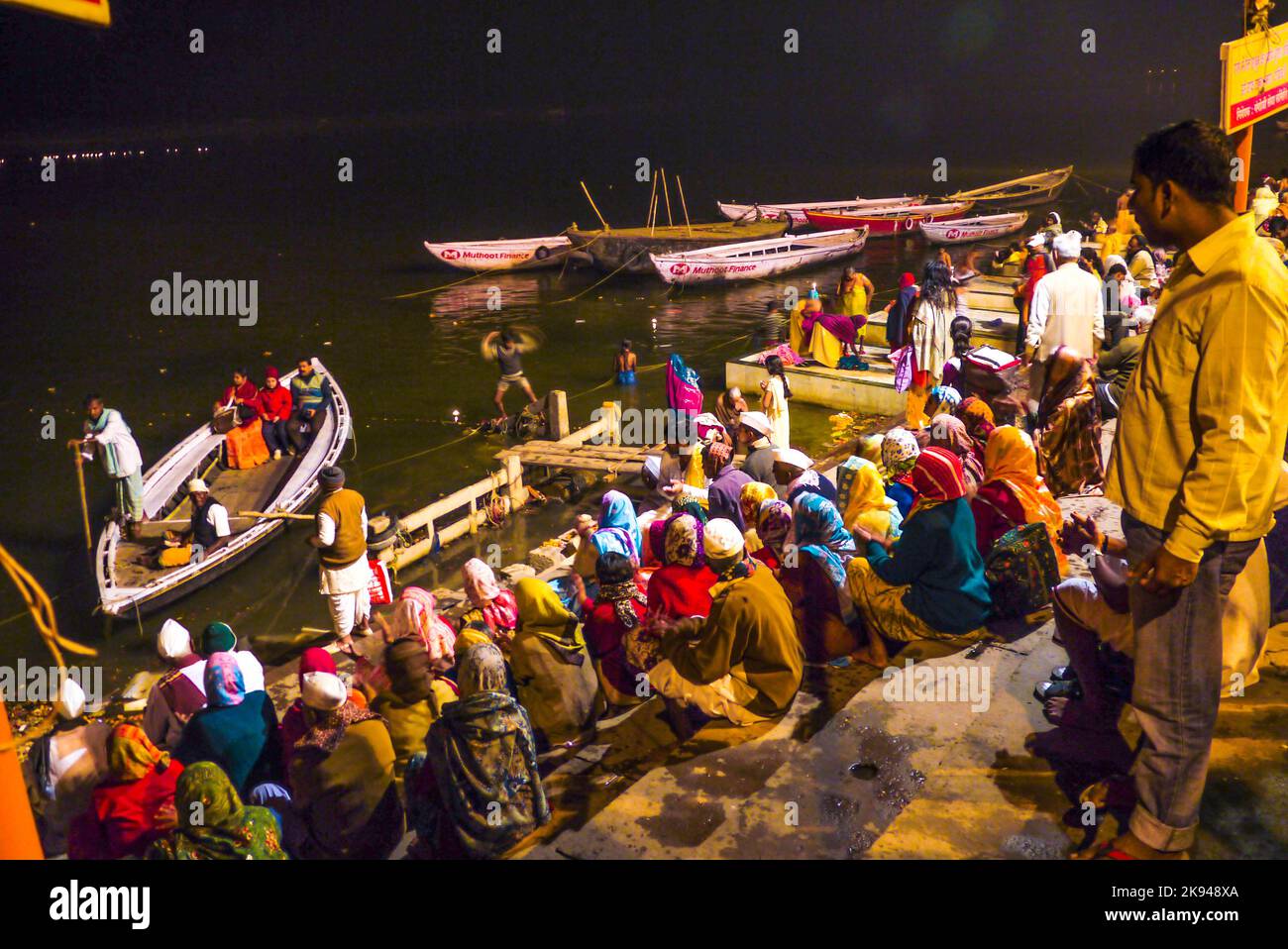 Varanasi, India - December 10, 2009: Hindu people wash themselves in ...