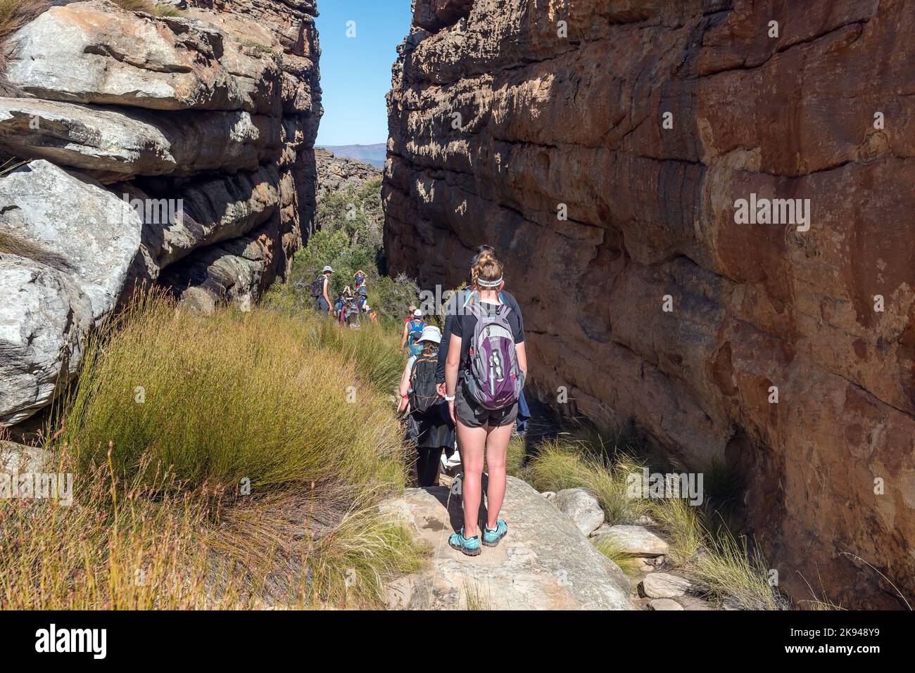 SANDDRIF, SOUTH AFRICA - SEP 7, 2022: Hikers descending Wolfberg via ...