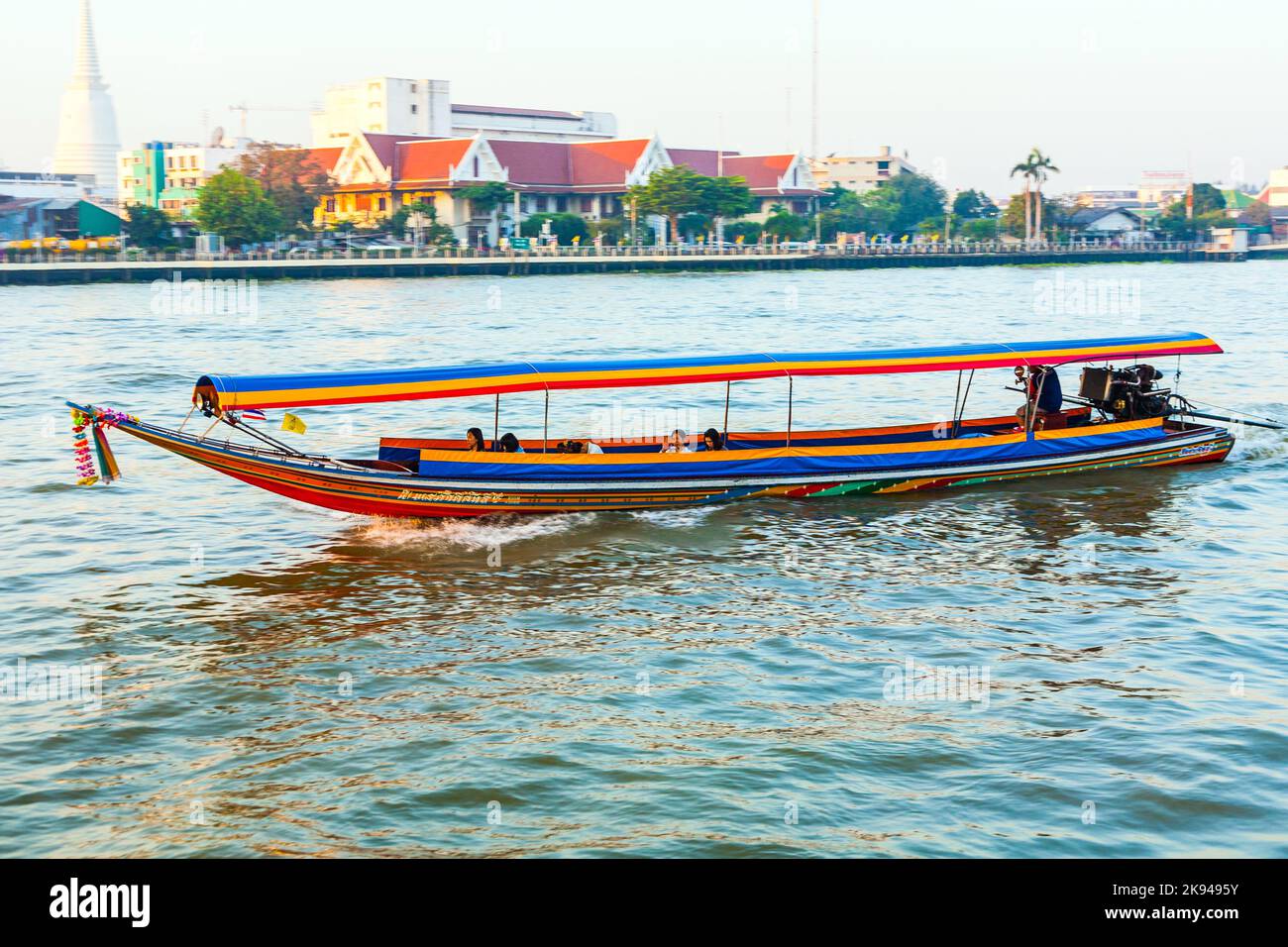 BANGKOK, THAILAND - DEC 23: people in the boat at the river Mae Nam ...