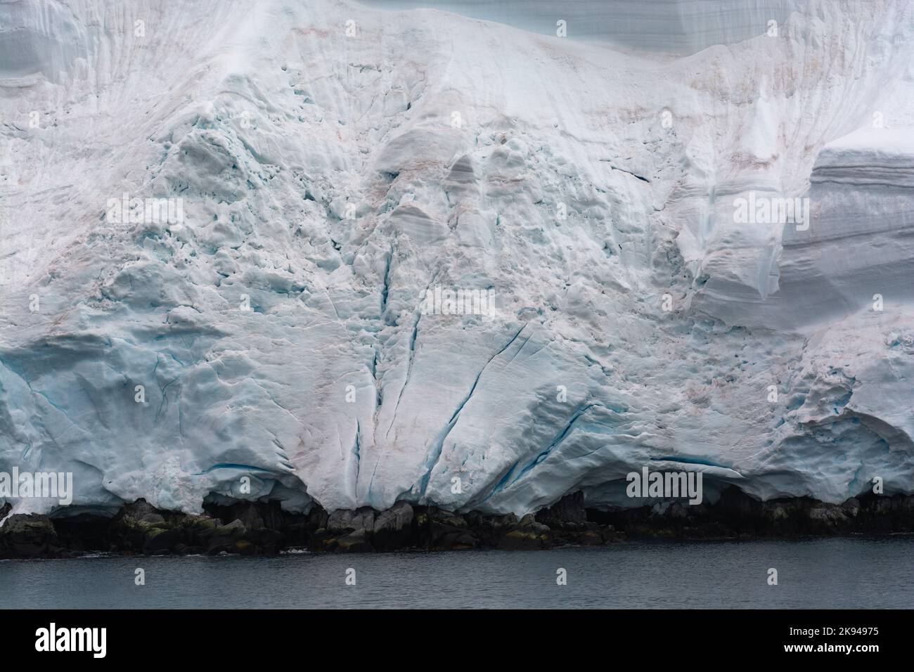 snow and ice details on shores of islands in antarctic peninsula ...