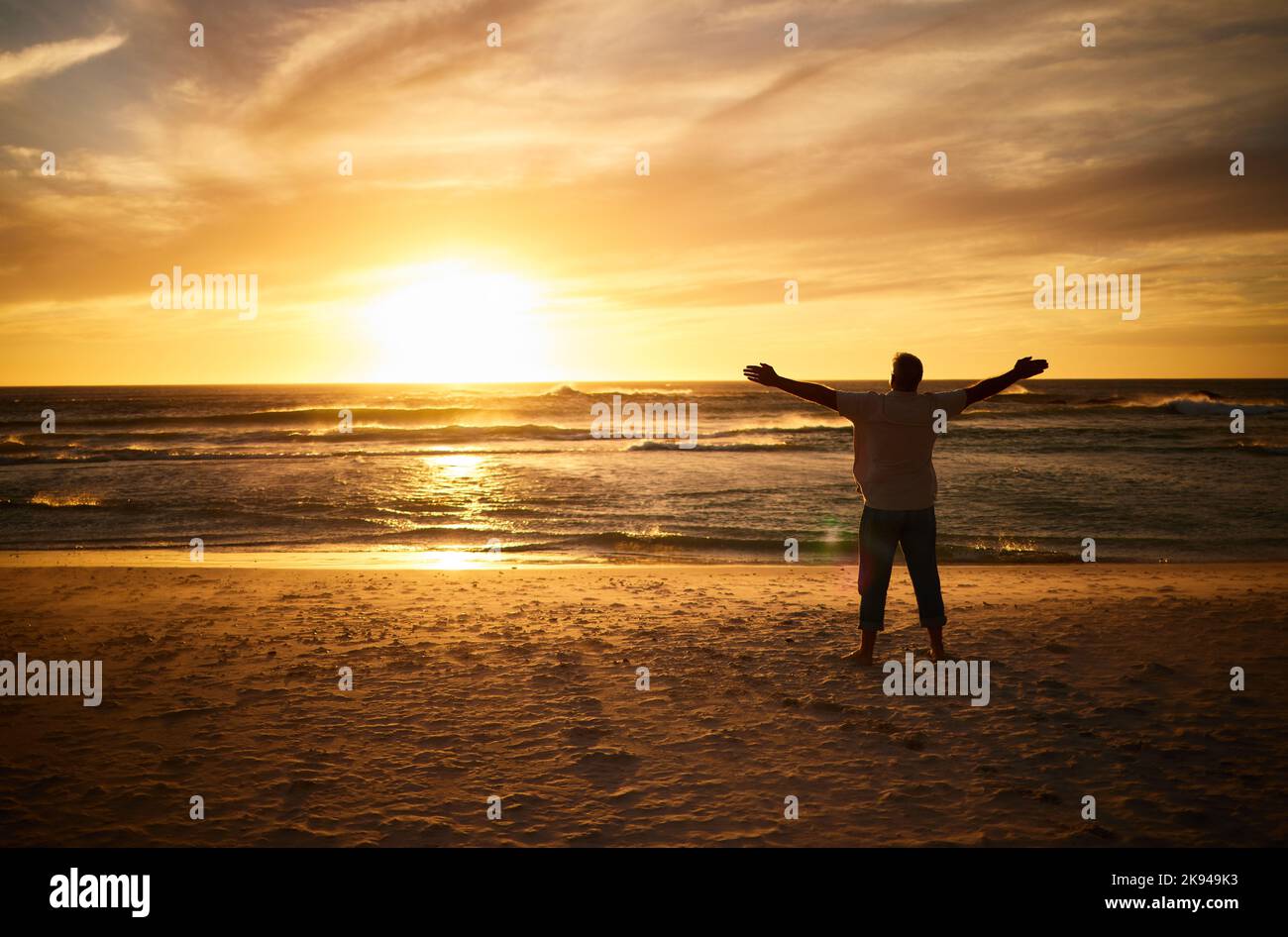 Freedom, beach and man silhouette celebration at sunset, happy and ...