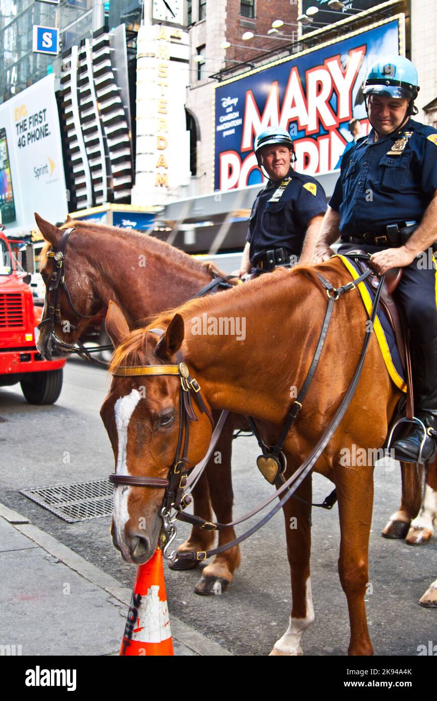 New York, USA - July 9, 2010: policeofficer is riding his horse ...
