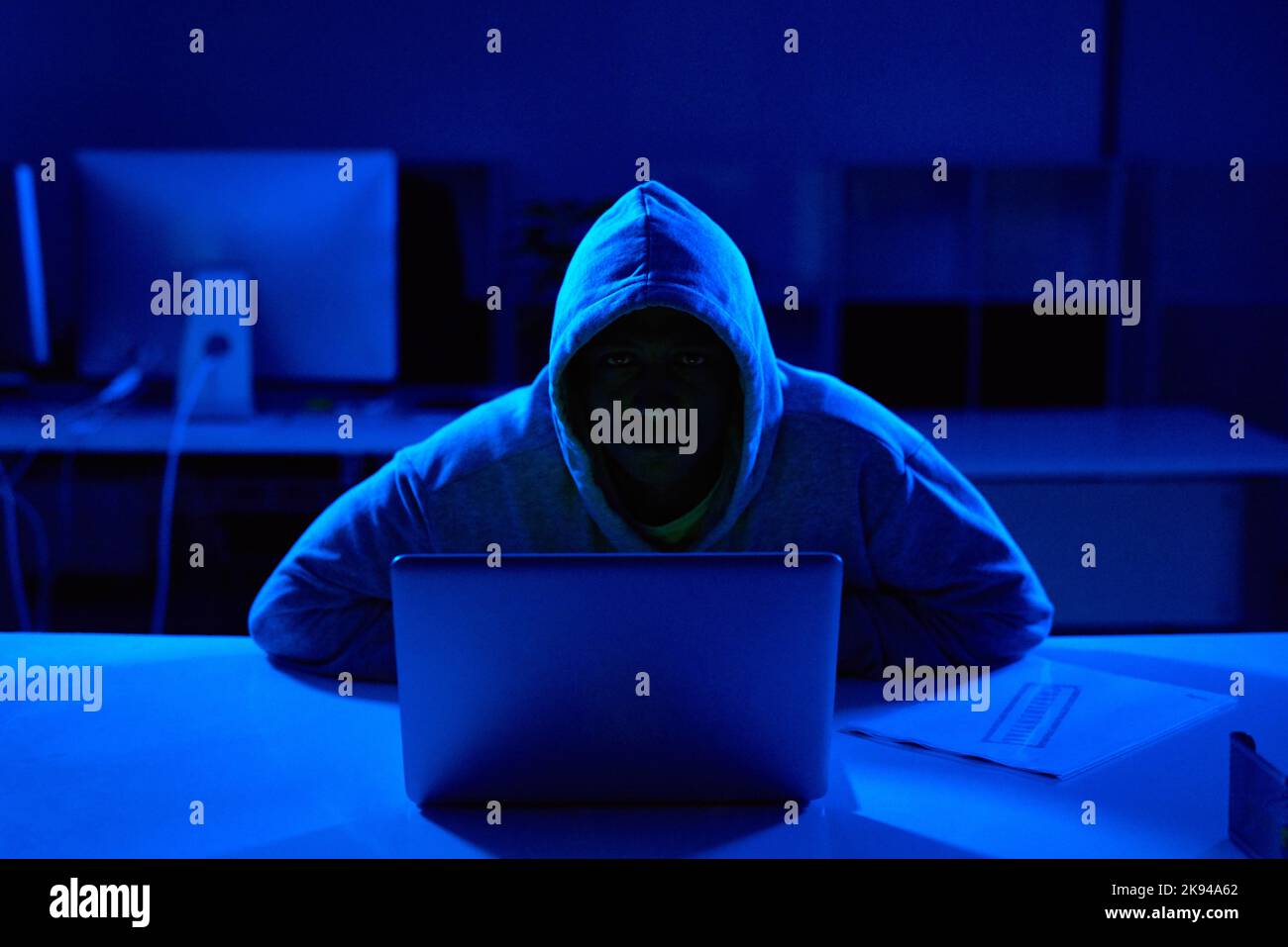You wont see it coming till its too late. an unrecognizable hacker cracking a computer code in ...