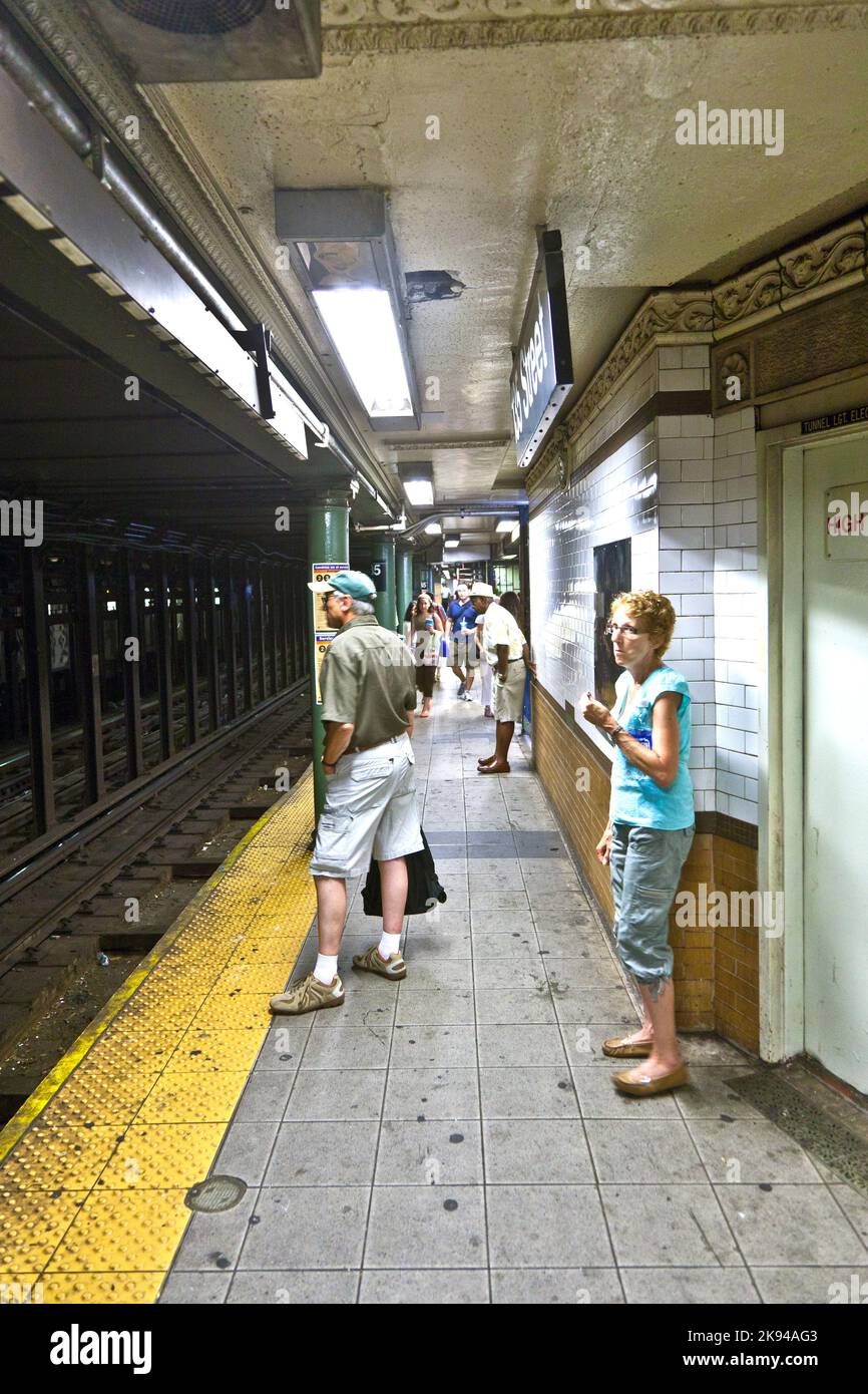 NEW YORK CITY - July 11: people wait fur subway in 135 street on July ...