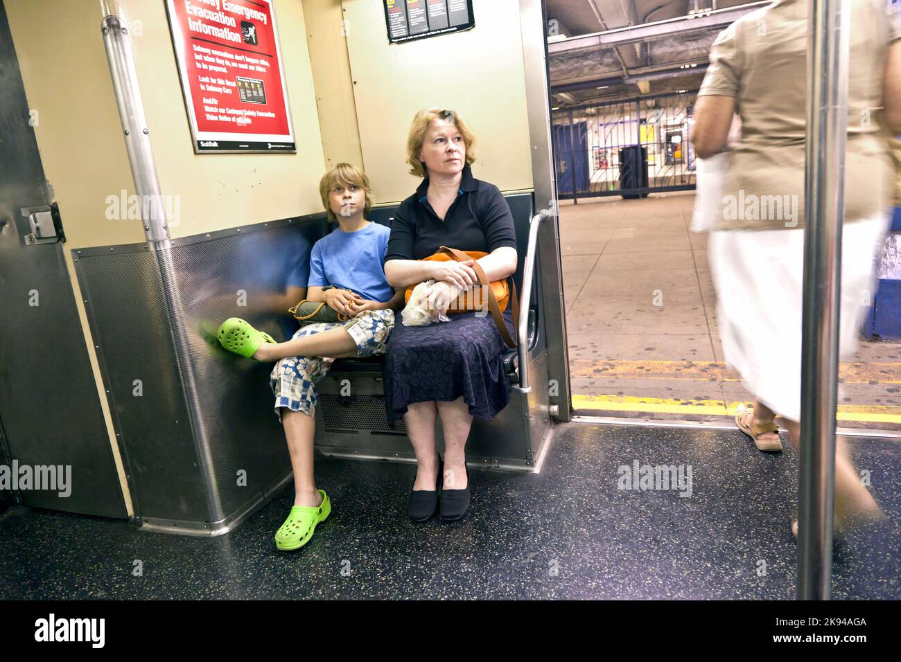 NEW YORK CITY - JULY 11: mother and child sit in metro on July 11, 2010 ...