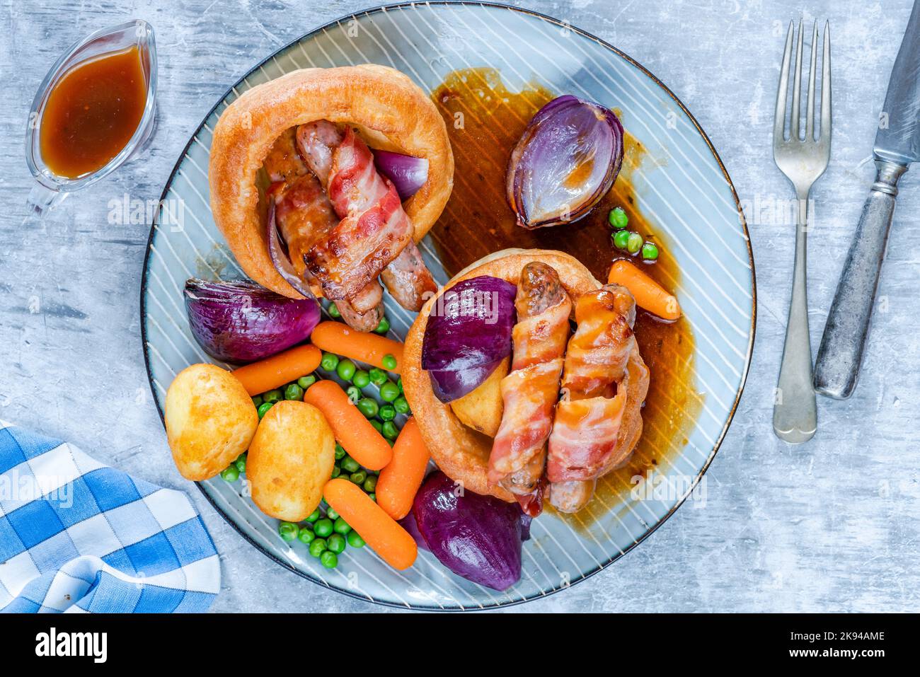 Toad in the hole with Yorkshire pudding, sausages and vegetables Stock ...