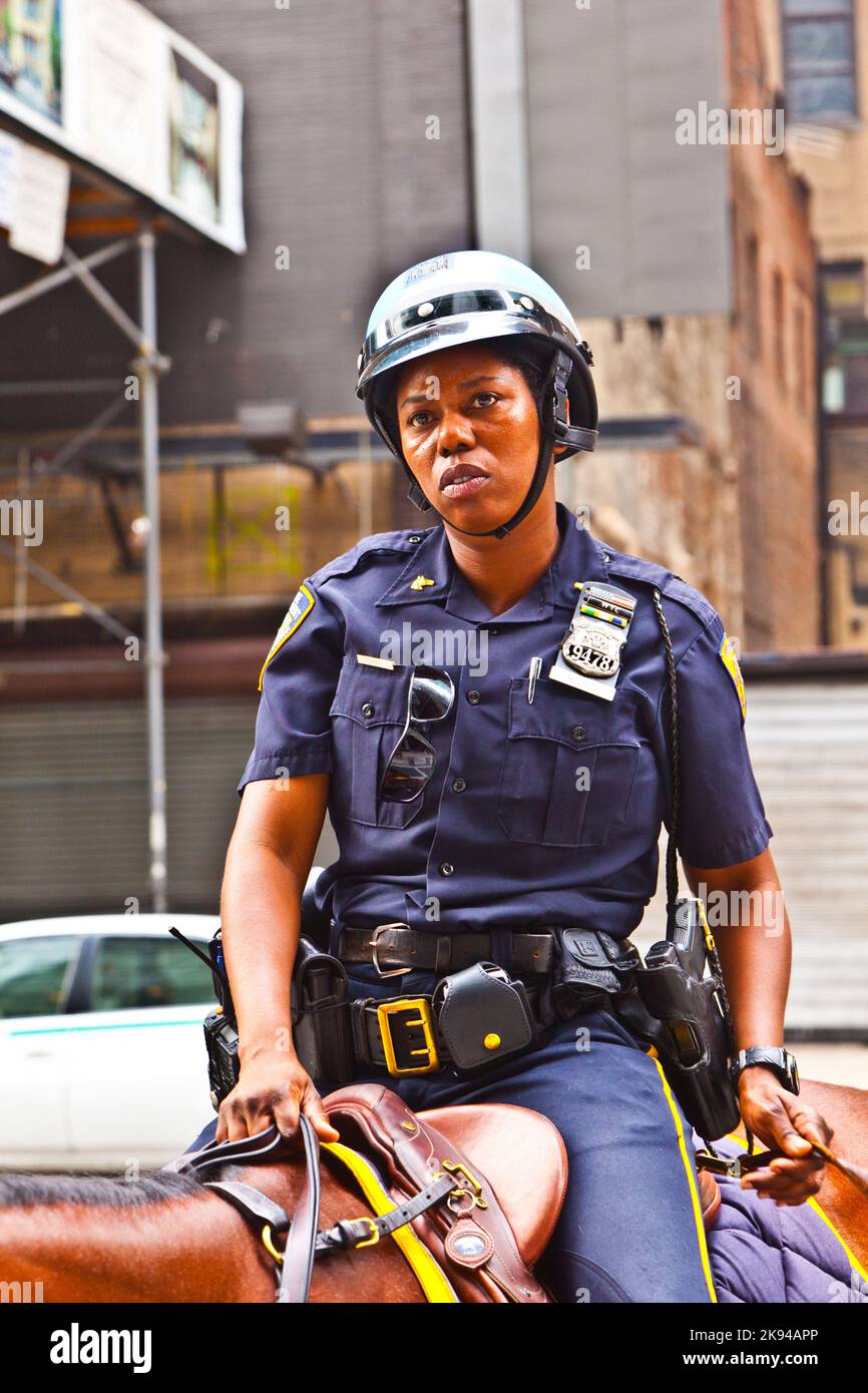 New York, USA - July 12, 2010: policeofficer is riding his horse ...