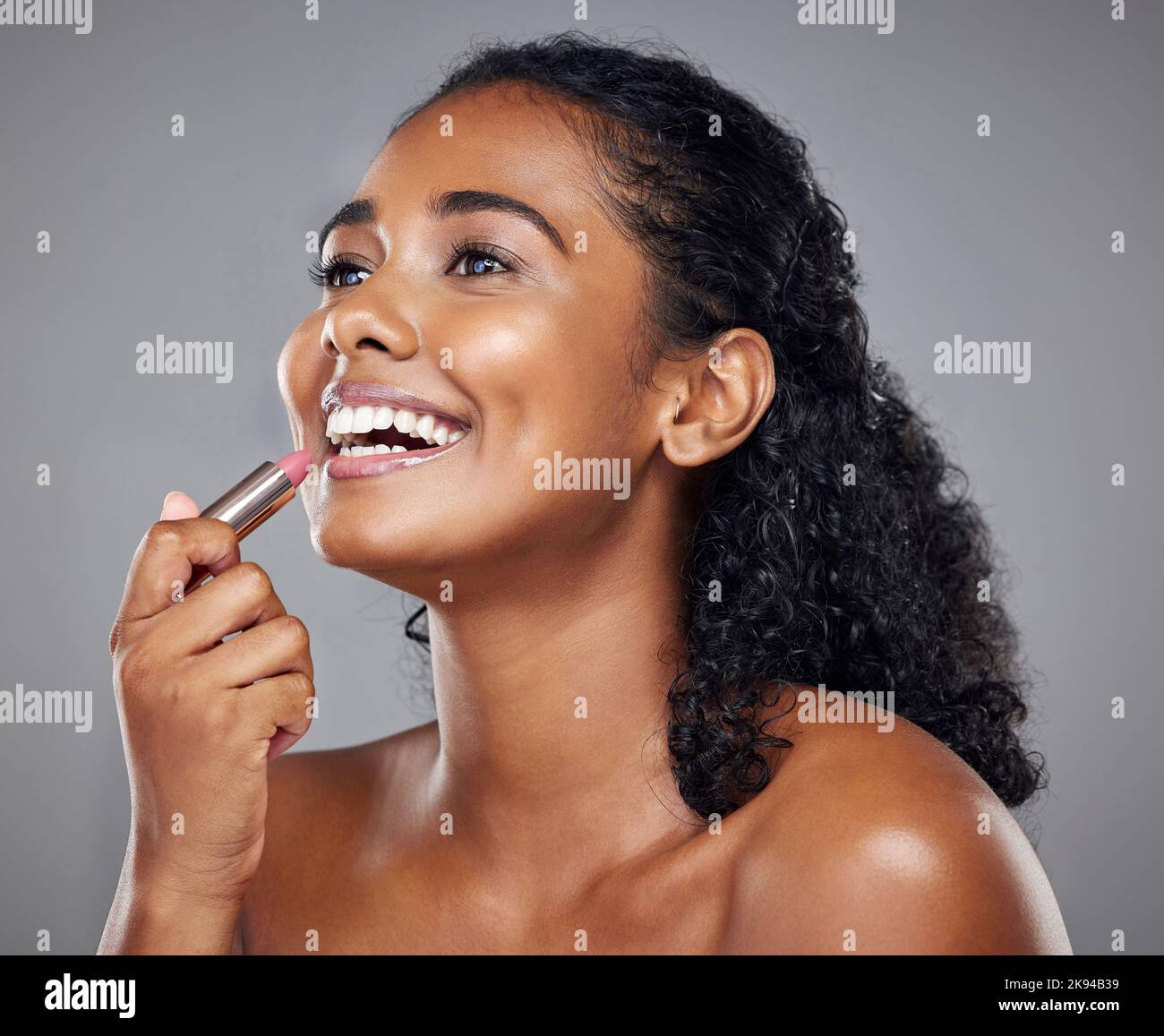 Lipstick, makeup and black woman with smile, thinking and idea against ...