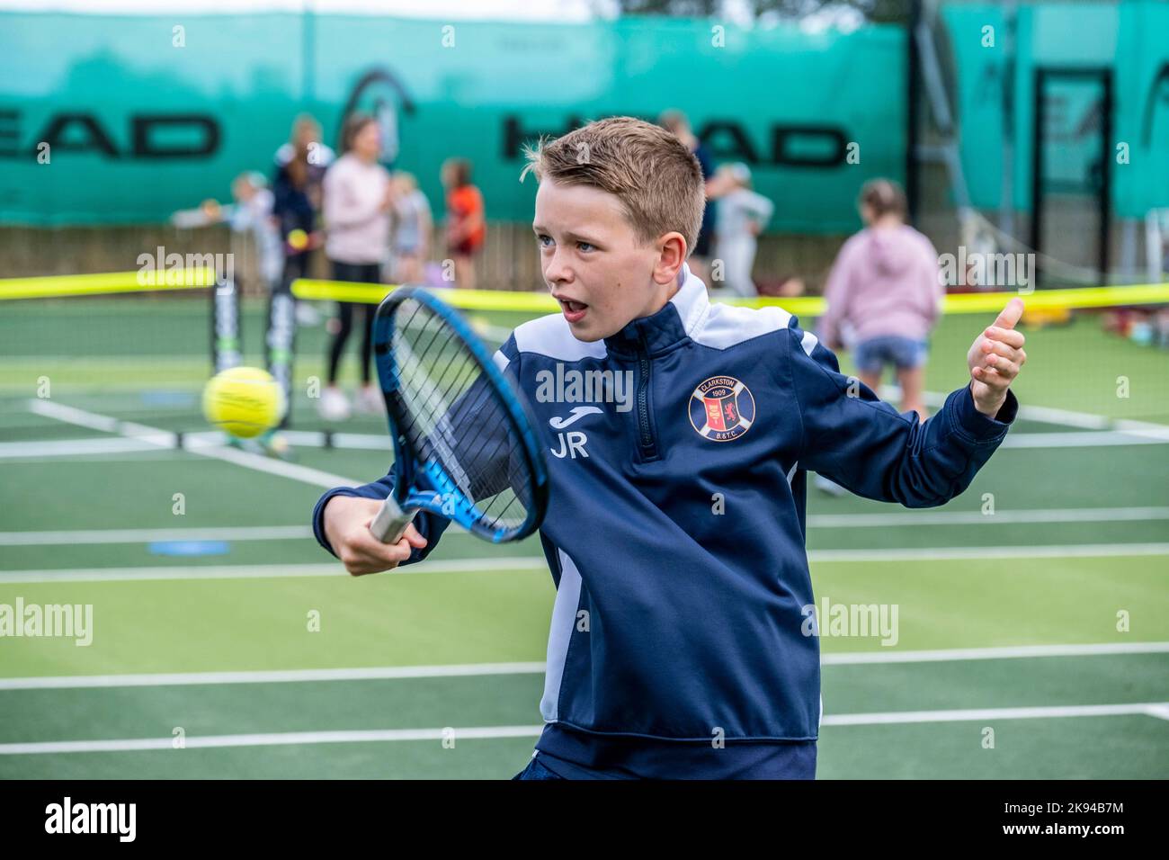 Children playing tennis and having tennis lessons Stock Photo - Alamy