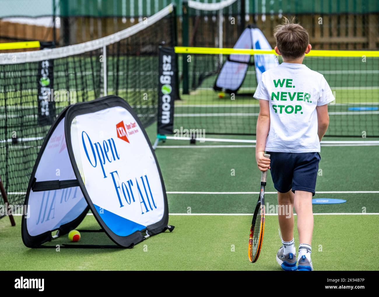 Children playing tennis and having tennis lessons Stock Photo - Alamy
