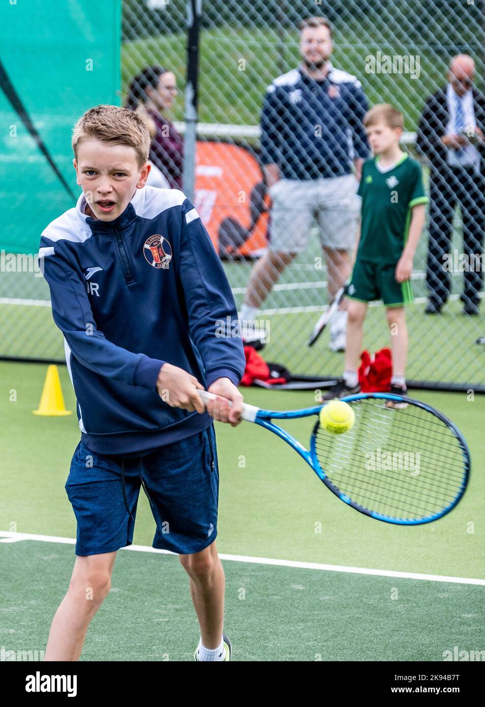 Children playing tennis and having tennis lessons Stock Photo - Alamy